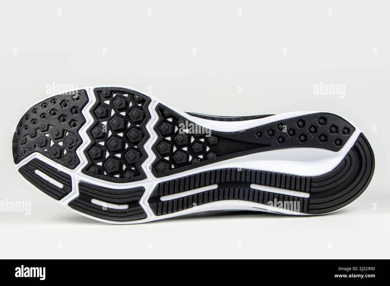 Sole of sport shoe on white background Stock Photo - Alamy