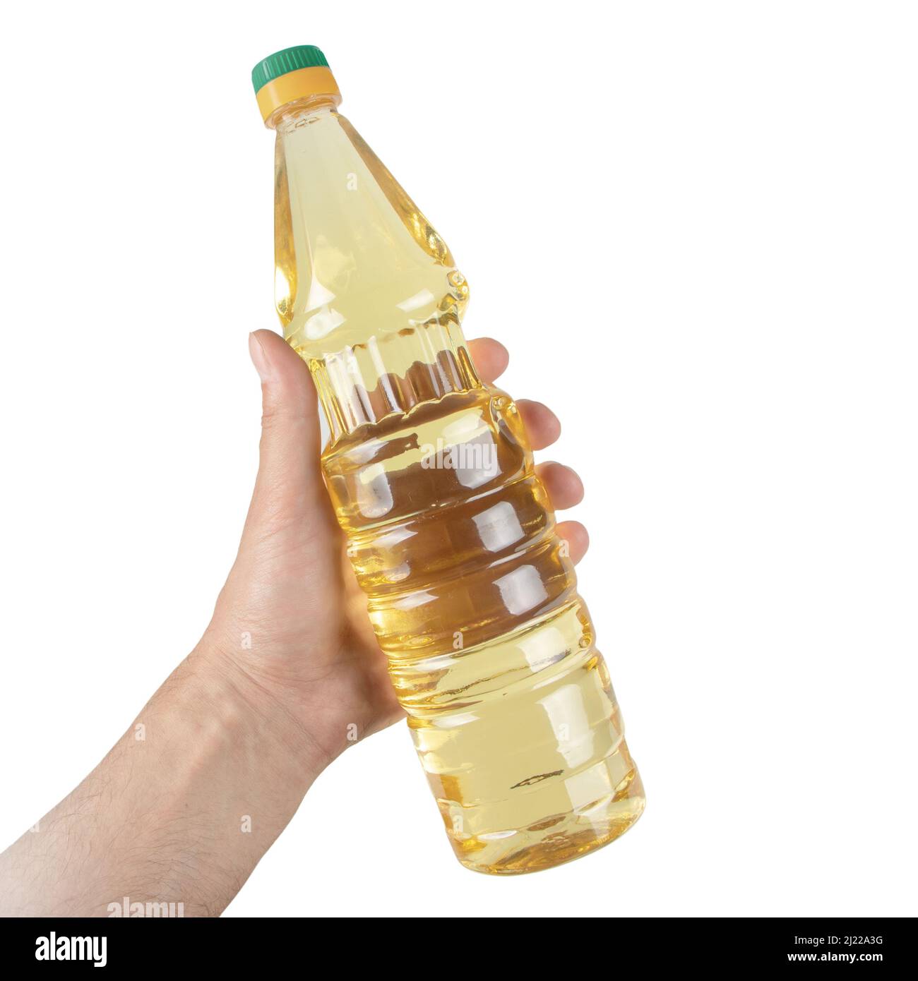 Hand with bottle of cooking oil isolated on white background Stock ...