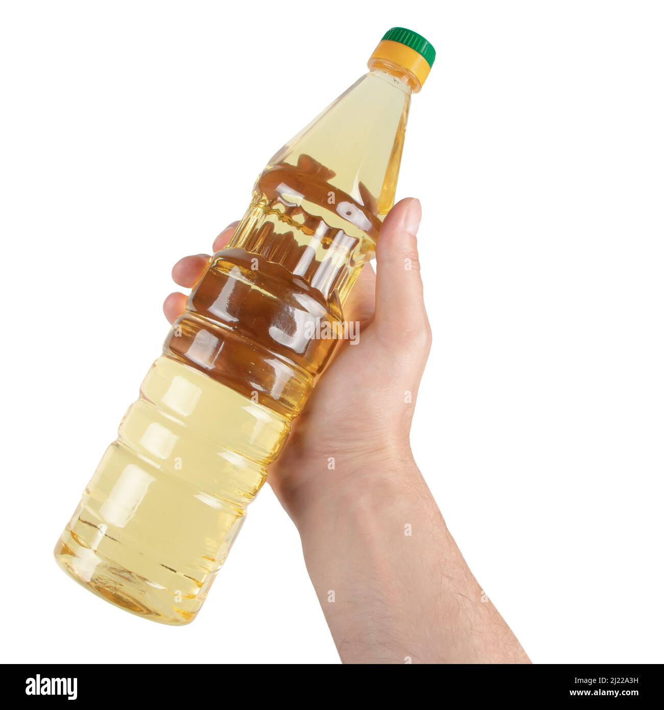 Hand with bottle of cooking oil isolated on white background Stock ...