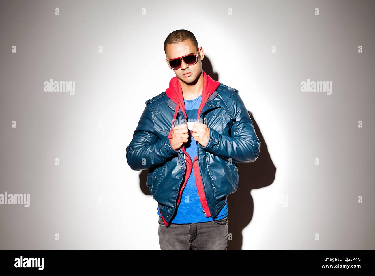 Hes got style. Shot of a handsome young man fashionably posing against ...