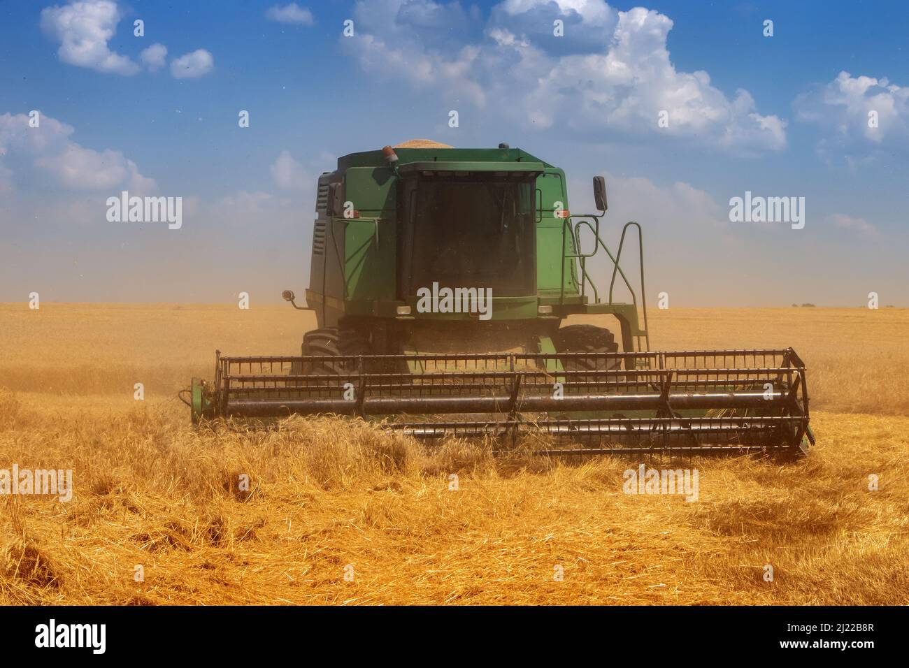 Harvester machine to harvest wheat field working. Combine harvester ...