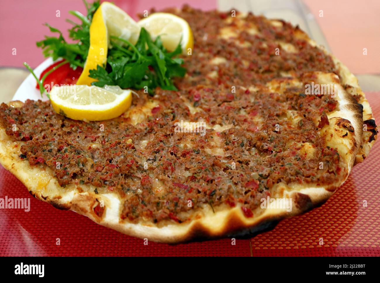 Plate of Lahmacun, a Thin and Crispy Turkish Pizza Topped with Spiced ...