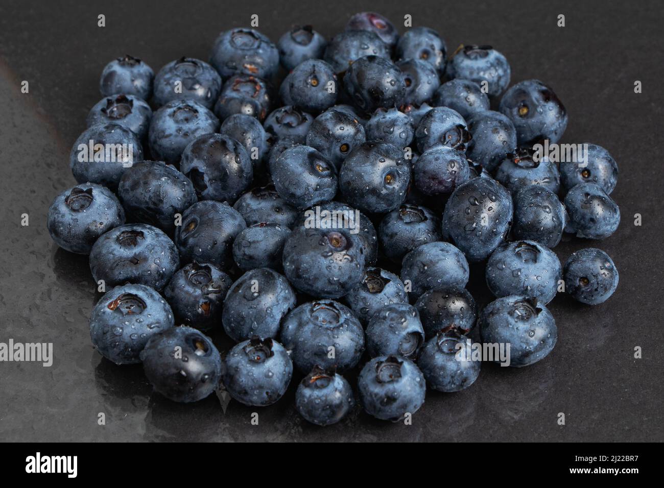 Blueberries fruit background. Water drops on ripe sweet blueberry ...