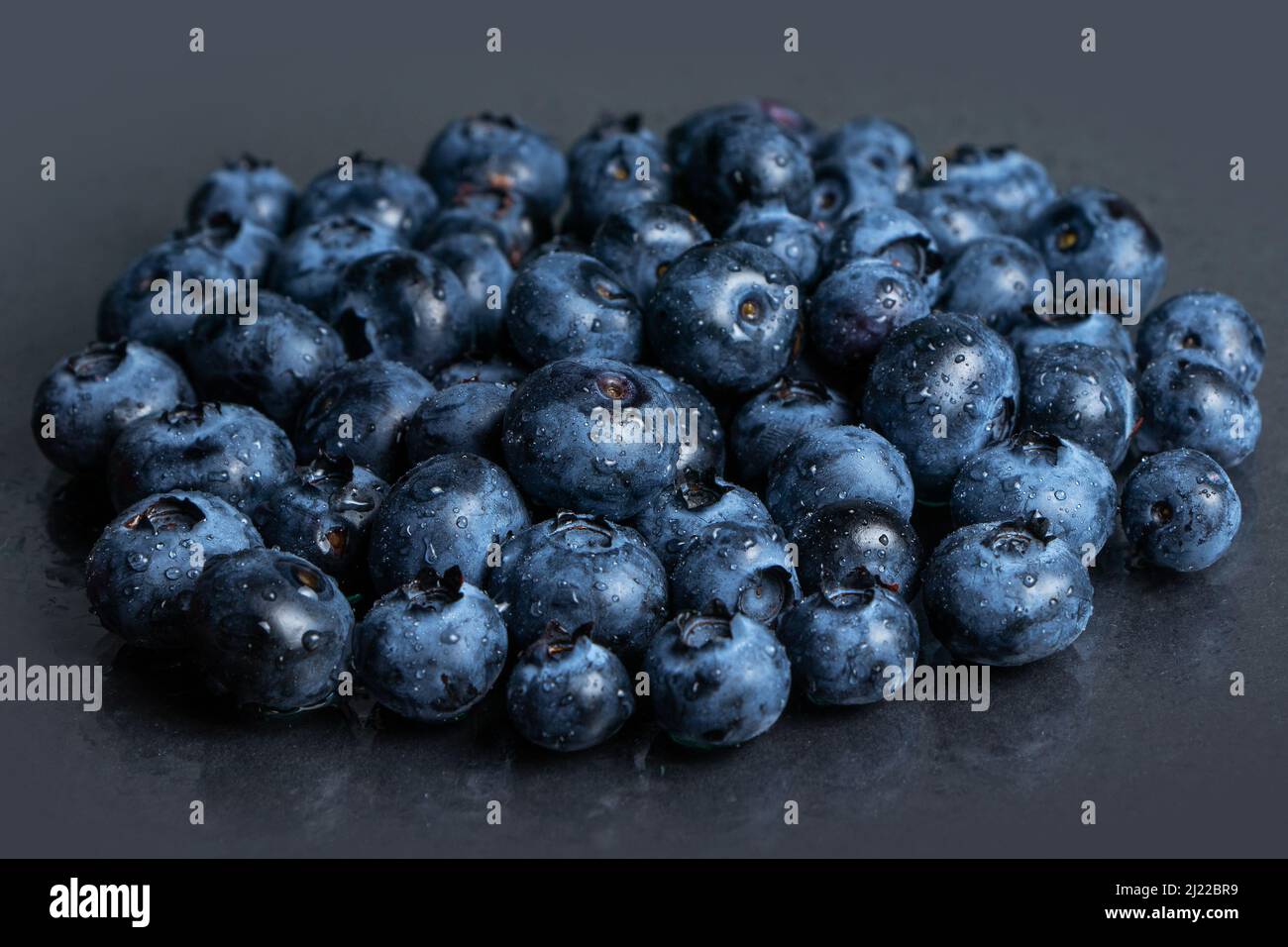 Blueberries fruit background. Water drops on ripe sweet blueberry ...