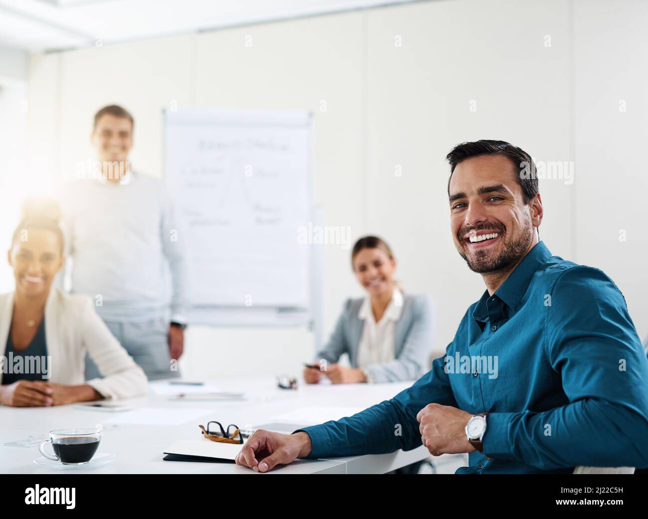Success will be ours no matter what. Portrait of a young businessman having a meeting with his ...