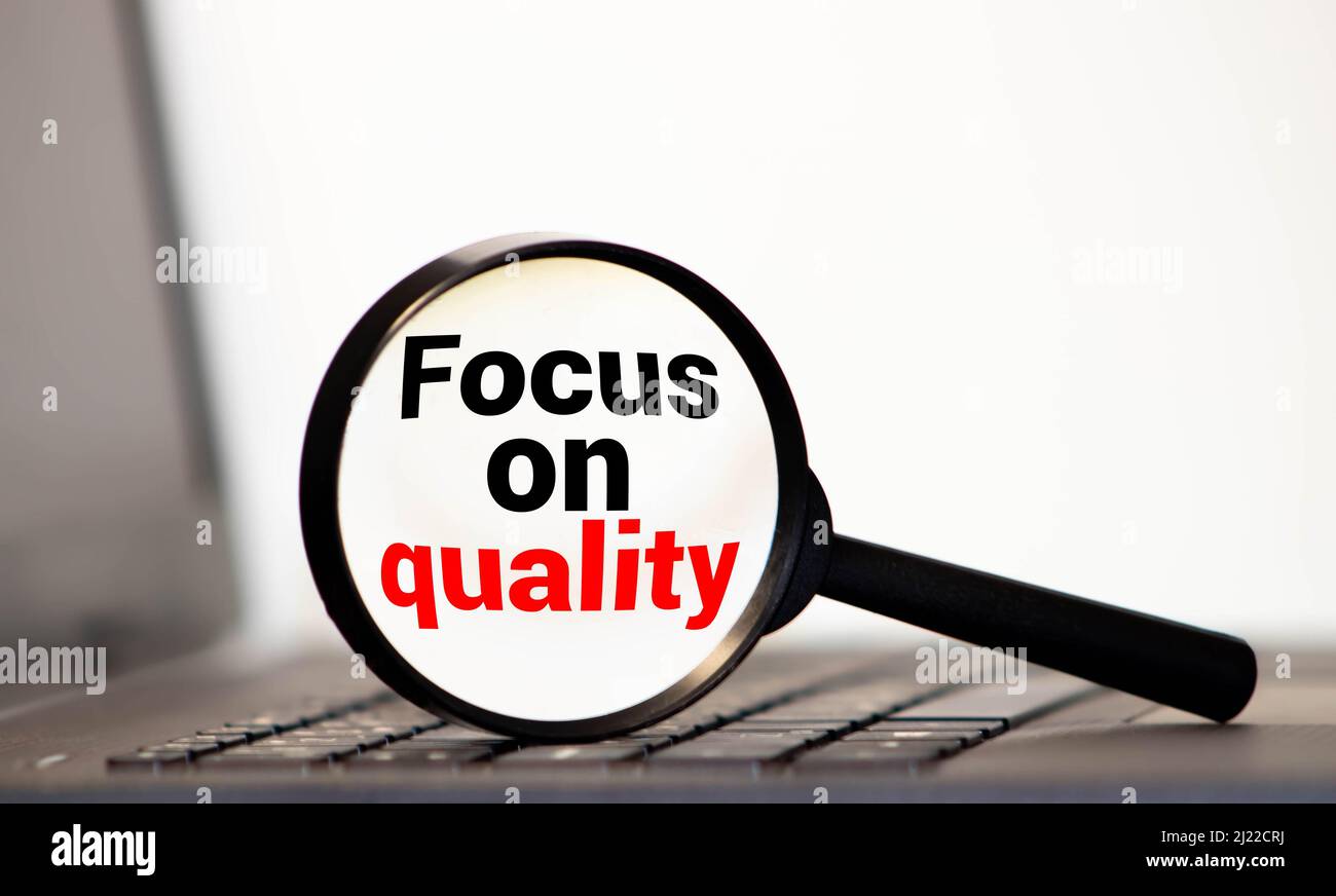 The word QUALITY CONTROL is magnified. Business concept Stock Photo - Alamy