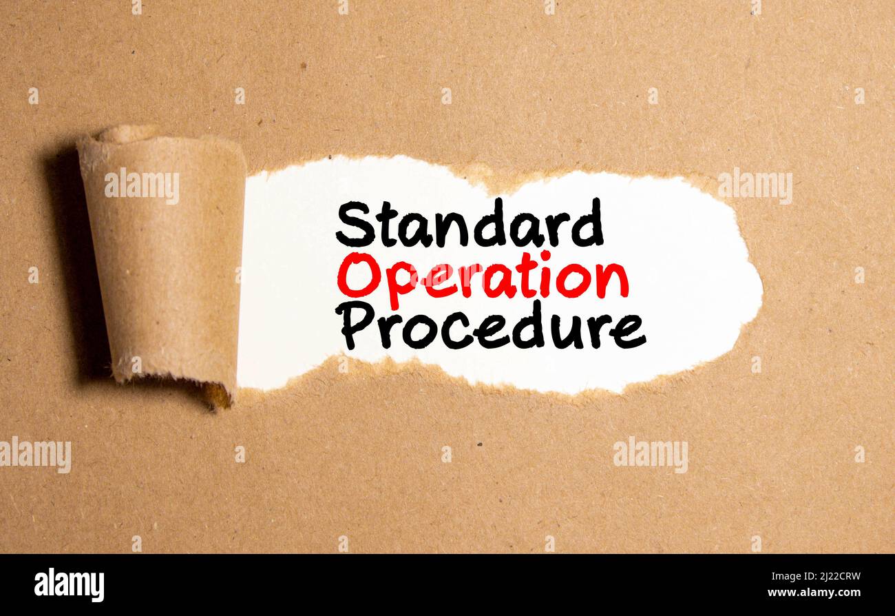 Standard Operating Procedure text on paper in open diary with ...