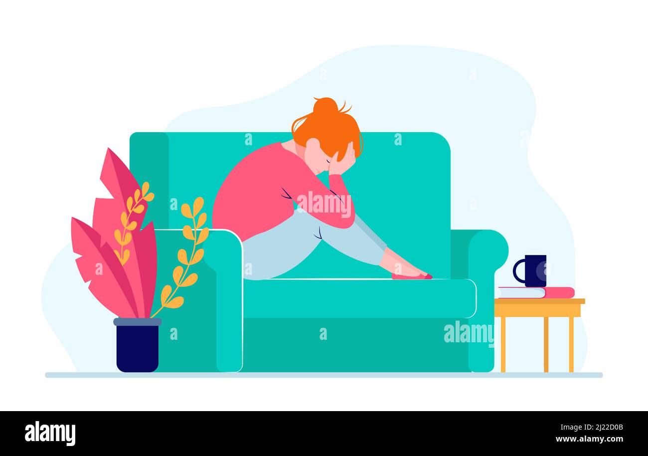 Young depressed woman sitting on sofa and holding head. Depression ...