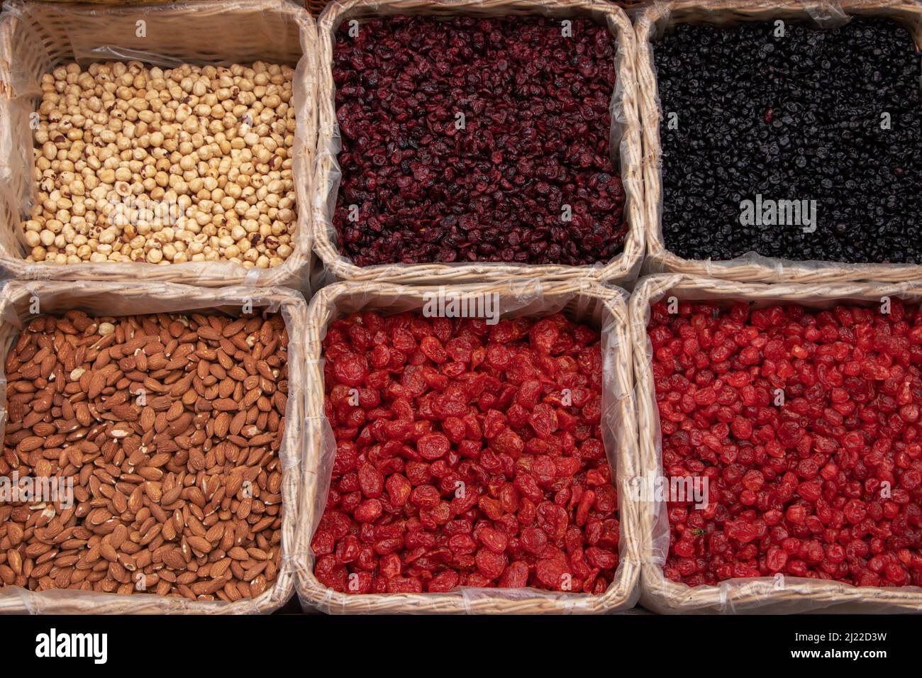 A set of dried fruits and nuts. The counter is on the market with dried ...