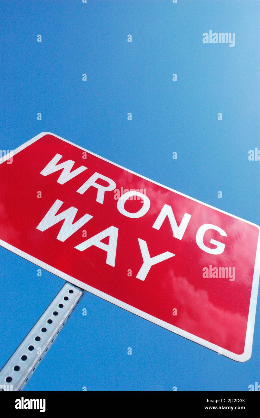 Wrong Way driving sign on highway as warning to drivers Stock Photo - Alamy
