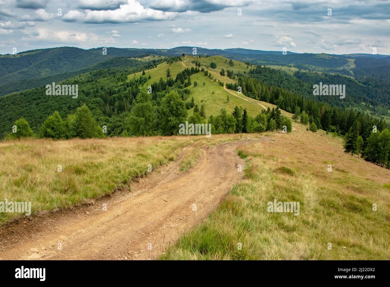 Mountain path to hill summer landscape Stock Photo - Alamy