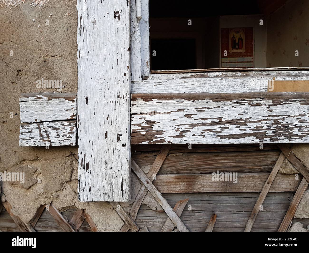 The windows of an old abandoned house with broken glass. An empty ...