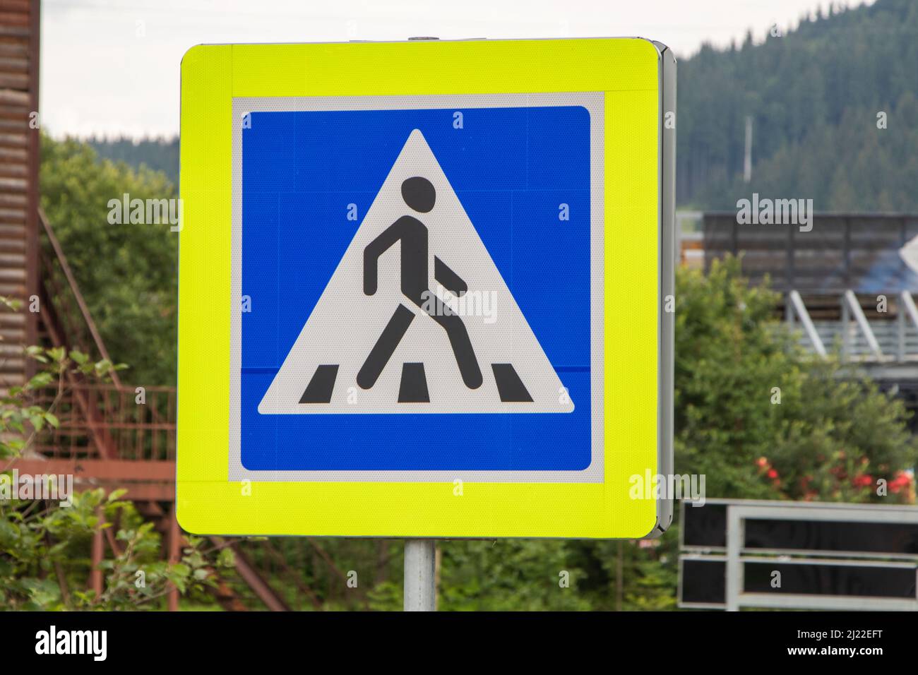 road sign pedestrian crossing on the street of the city. High quality ...