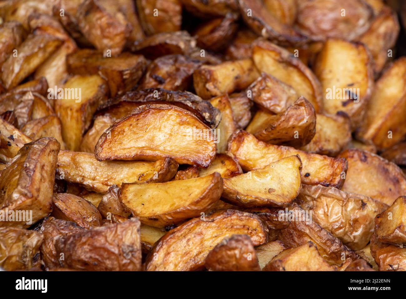Fried Potato wedges. Fast food background Stock Photo - Alamy