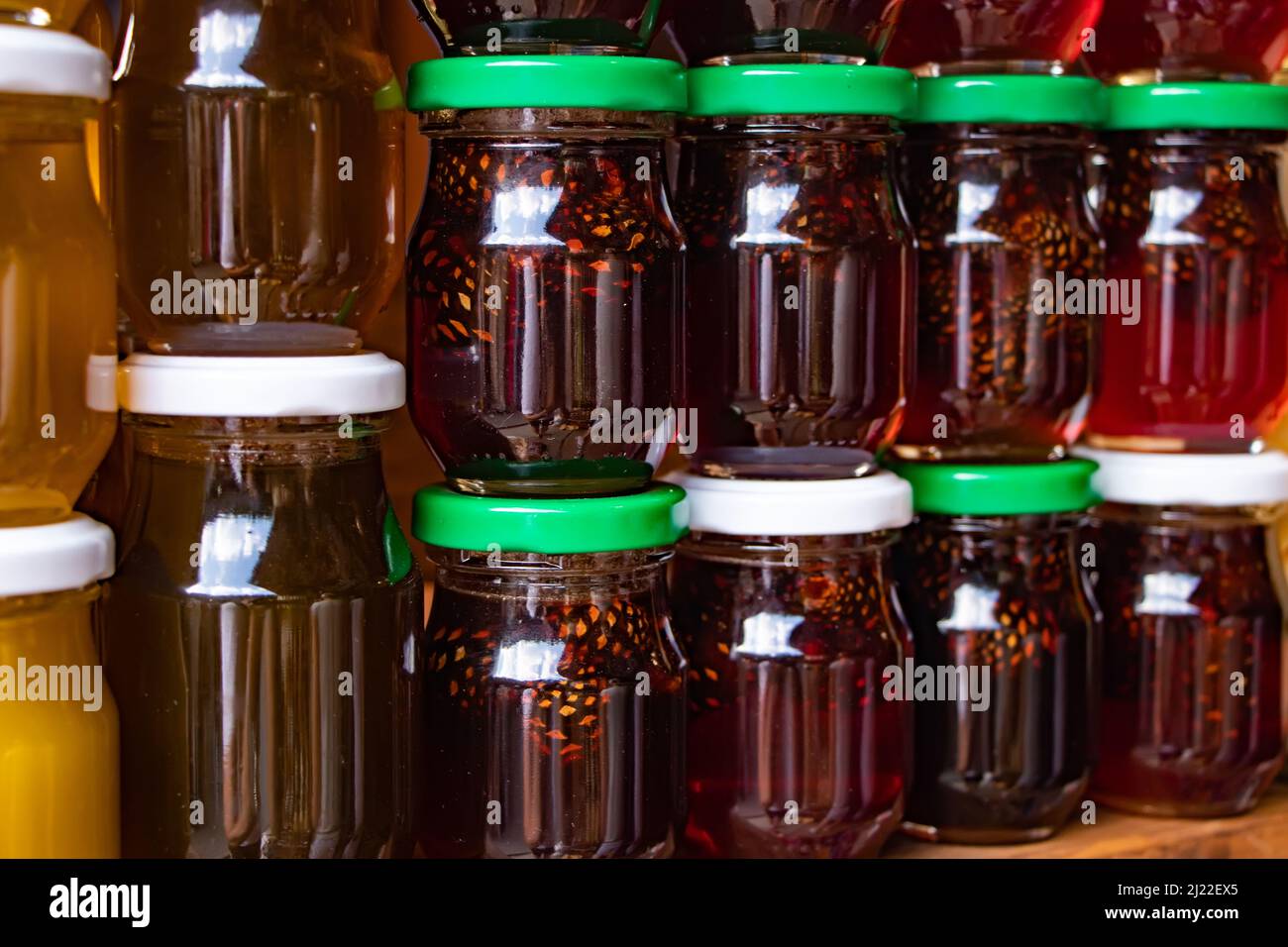 Pine cones in honey. Glass jars of pine cone jam Stock Photo - Alamy