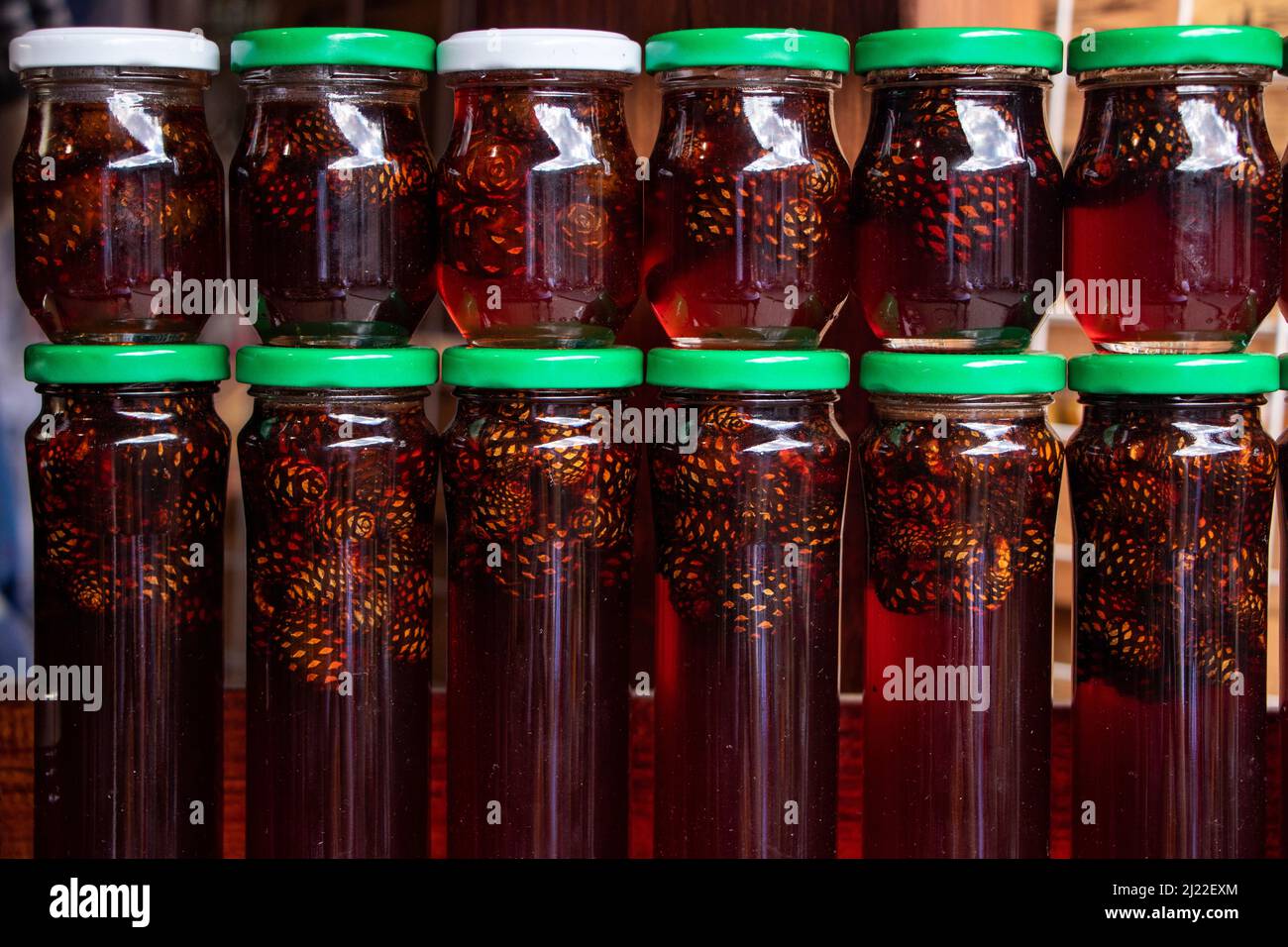 Pine cones in honey. Glass jars of pine cone jam Stock Photo - Alamy
