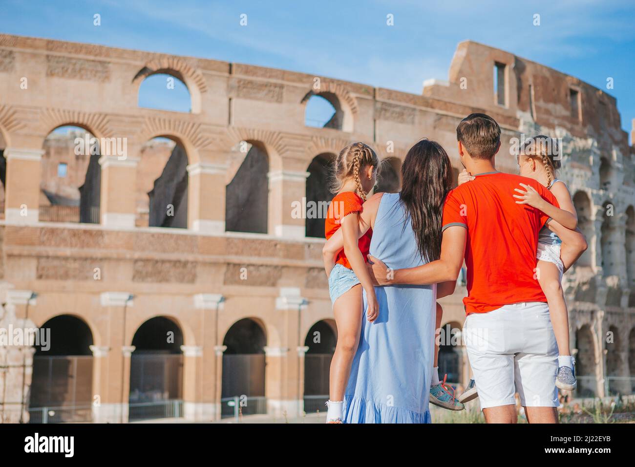 Happy family in Rome over Coliseum background having fun together Stock ...