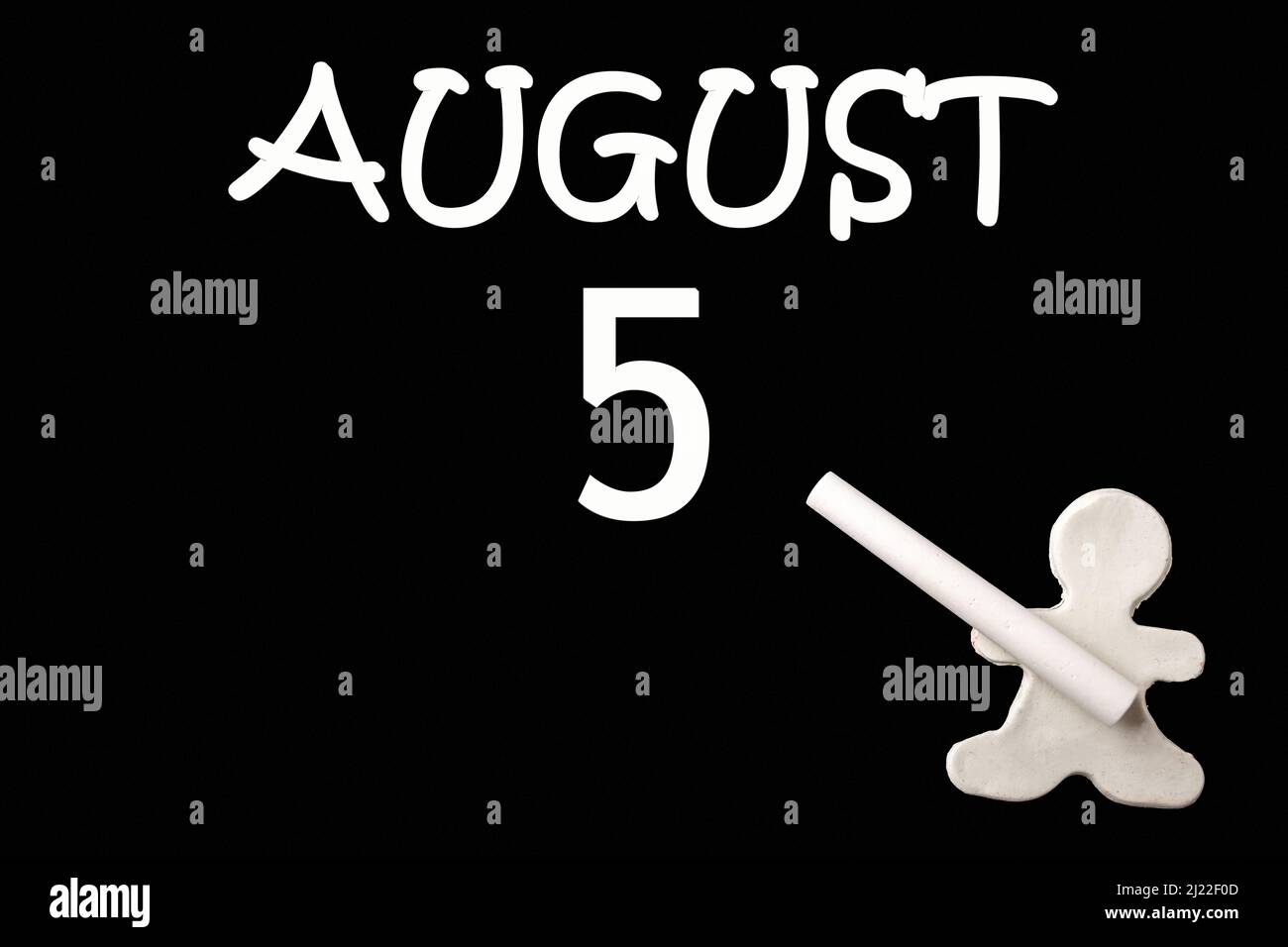 5th day of August. A small white plasticine man writing the date 5 ...