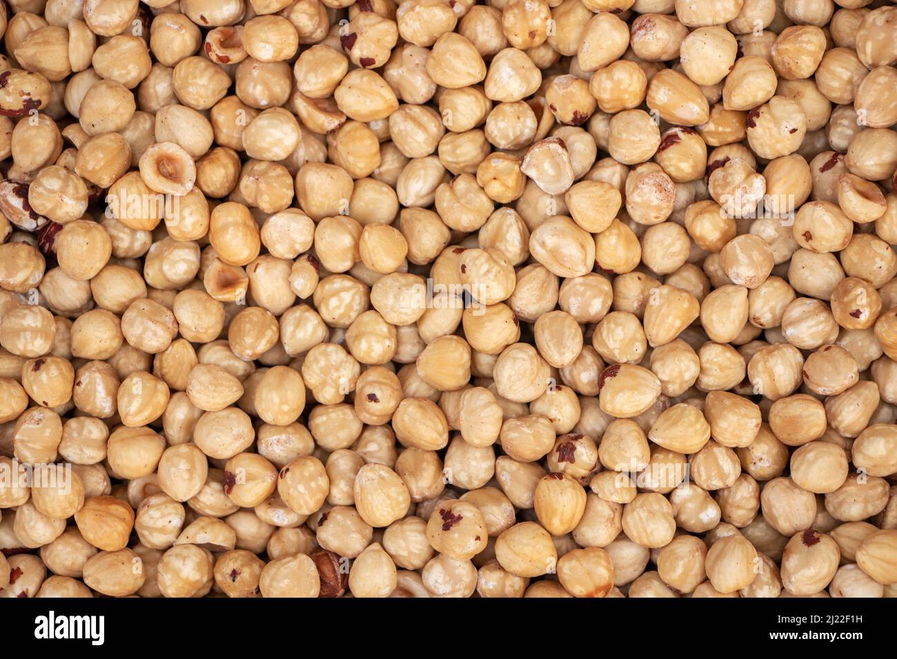 Hazelnut Background. Heap of peeled hazelnuts Stock Photo - Alamy