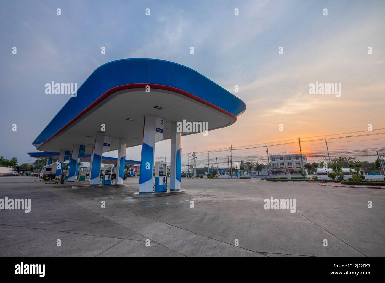 Gas station at sunset Stock Photo - Alamy
