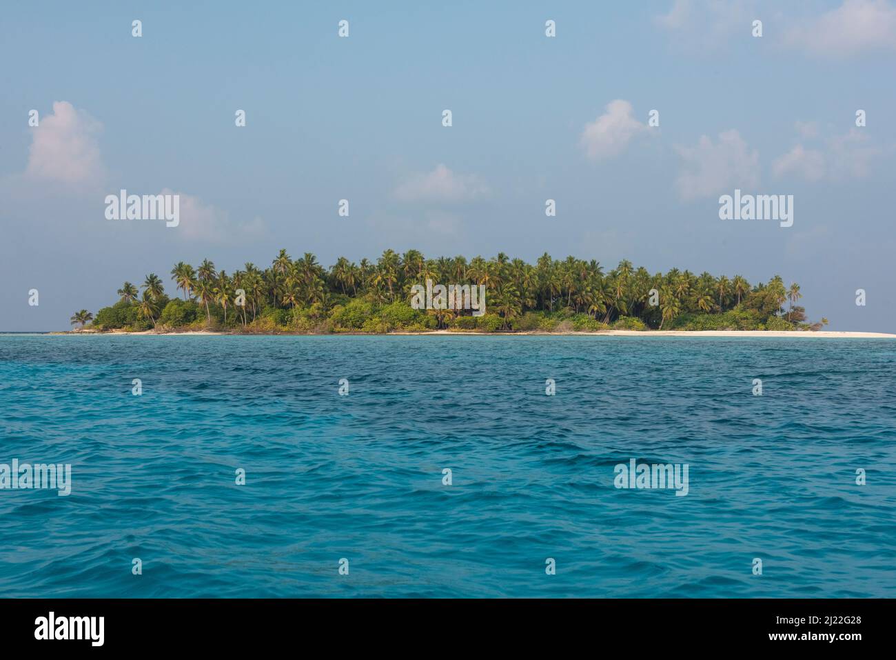 Remote tropical island paradise with shallow lagoon in ocean and thick ...