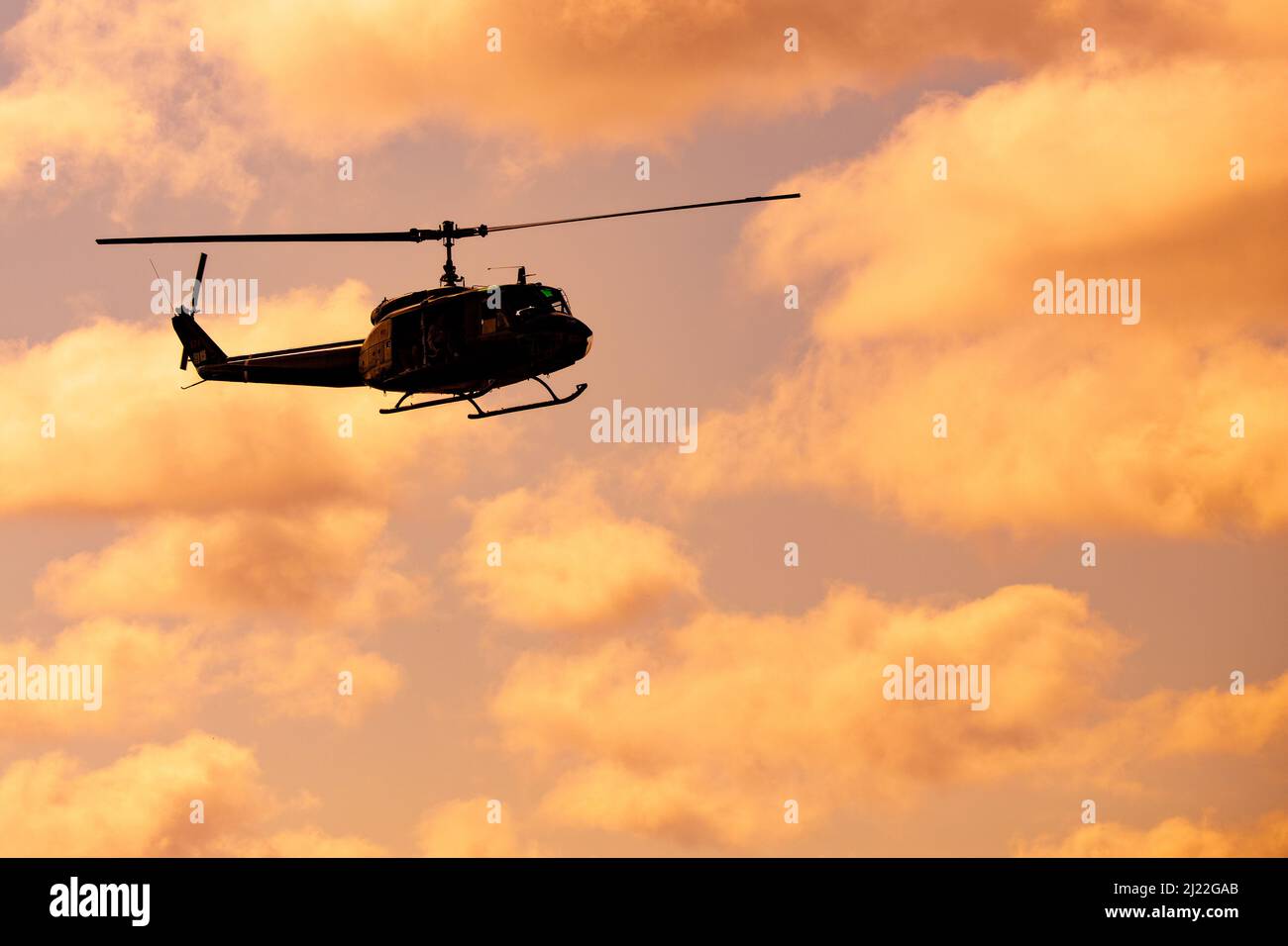 The silhouette of the helicopter in the beautiful sky at sunset Stock ...