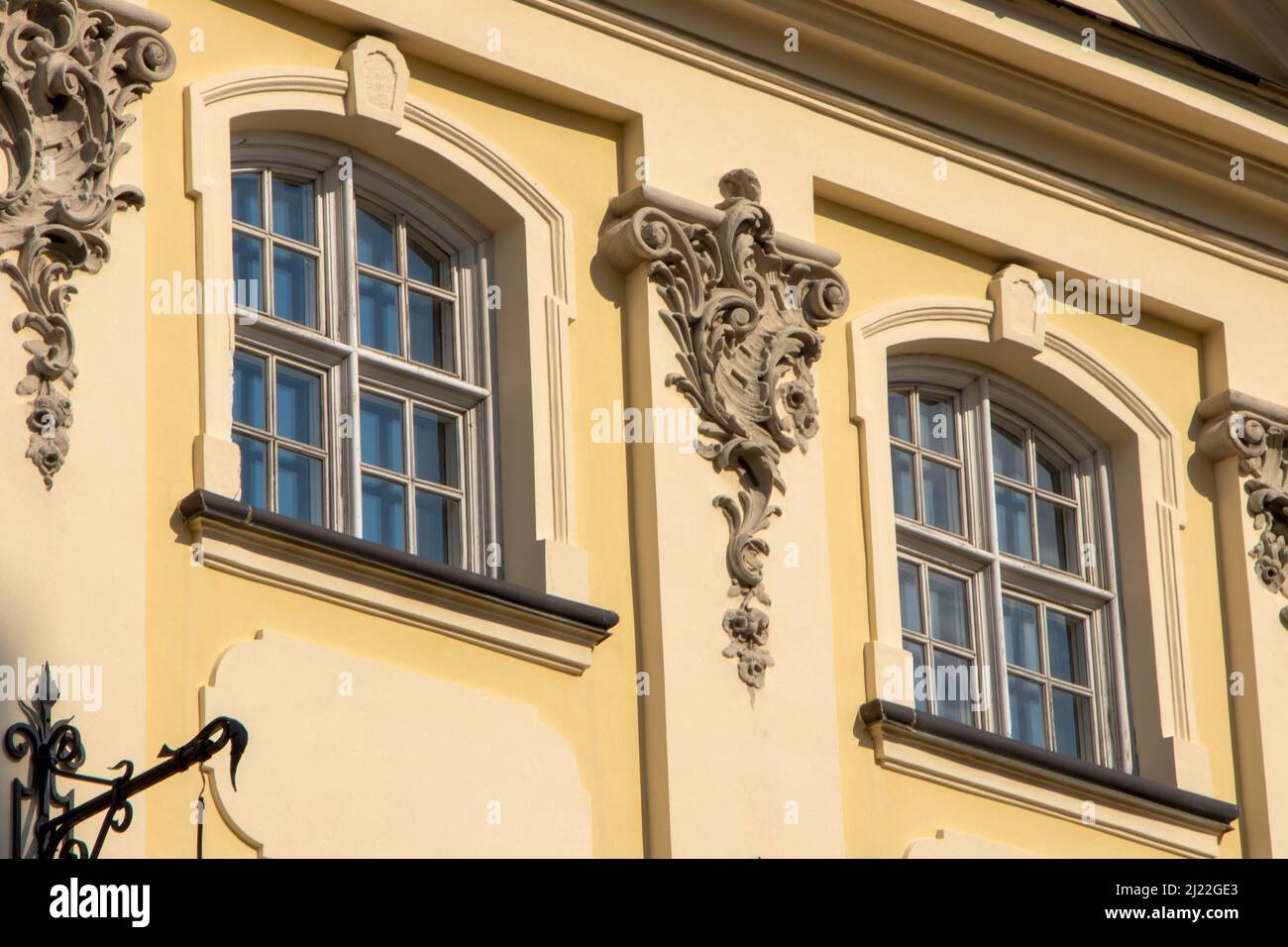 Old vintage arched windows glowing from inside Stock Photo - Alamy
