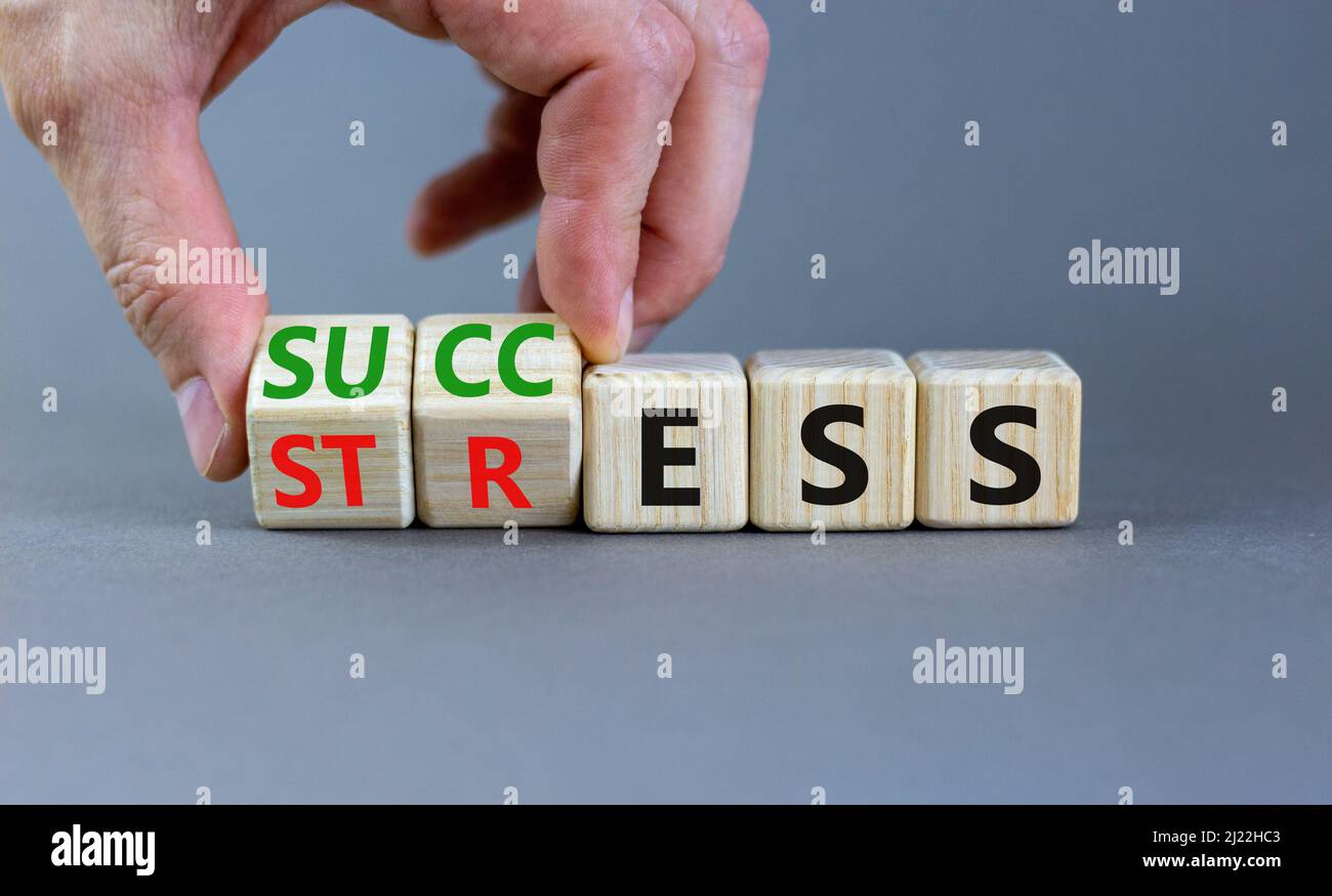 Success instead of stress symbol. Businessman turns cubes and changes ...
