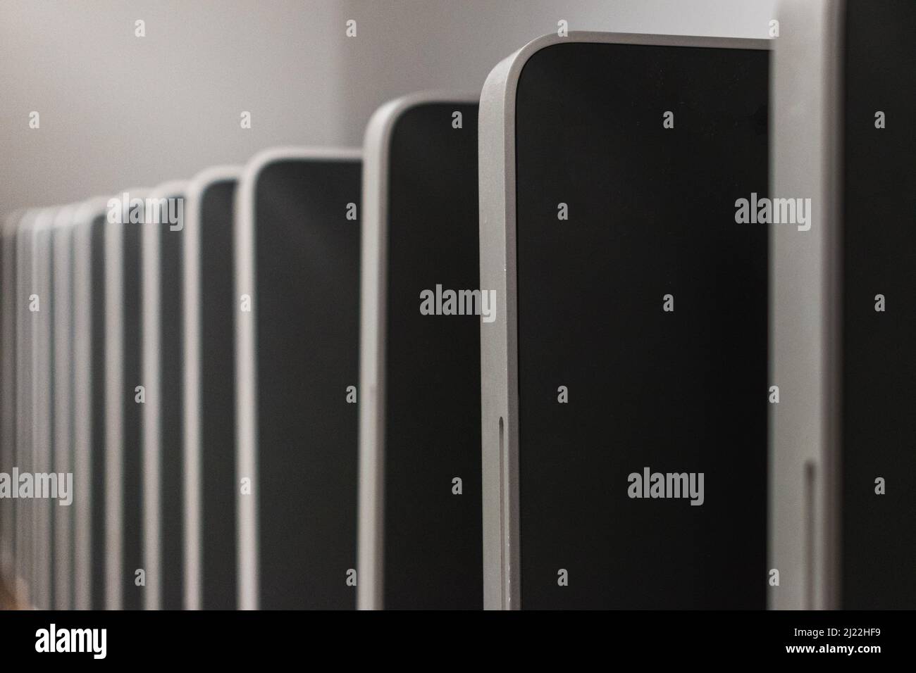 Lined up black computer screens seen from behind Stock Photo - Alamy
