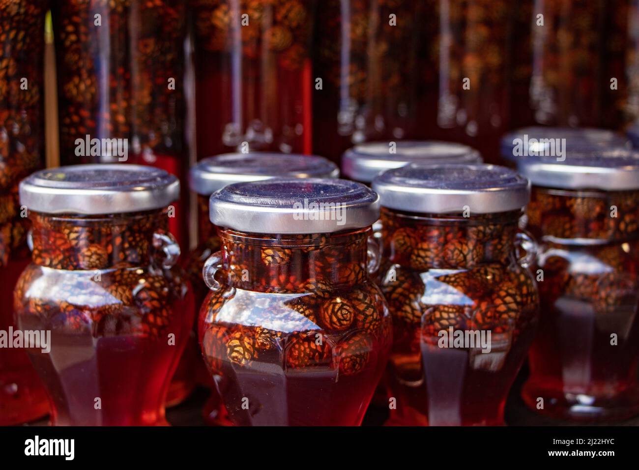 Pine cones in honey. Glass jars of pine cone jam Stock Photo - Alamy