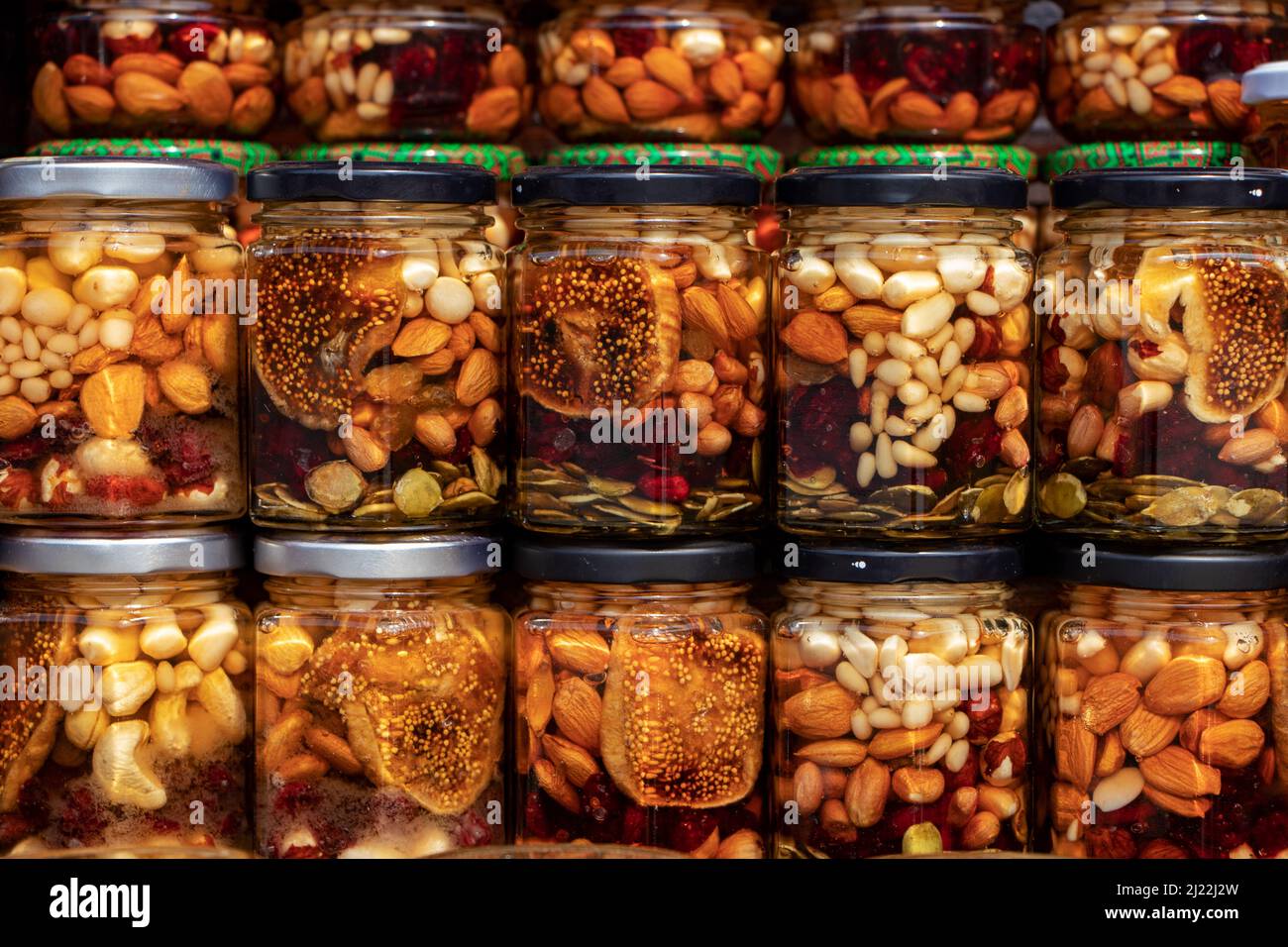Nut sets. Canned nuts with honey in glass jars. Harvest of nuts ...