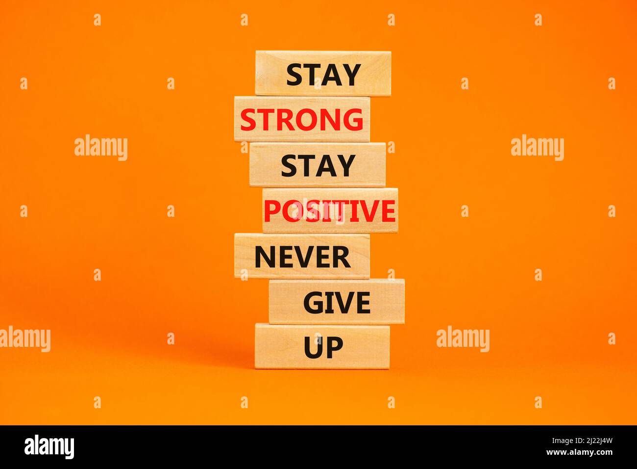 Never give up symbol. Wooden blocks with concept words Stay strong stay ...