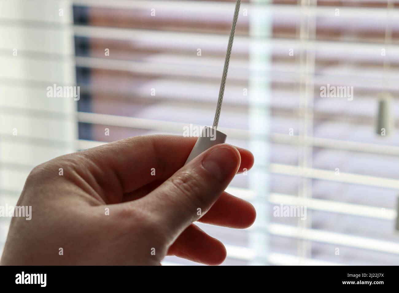 Opening / closing a window blind, venetian blind / horizontal blind ...