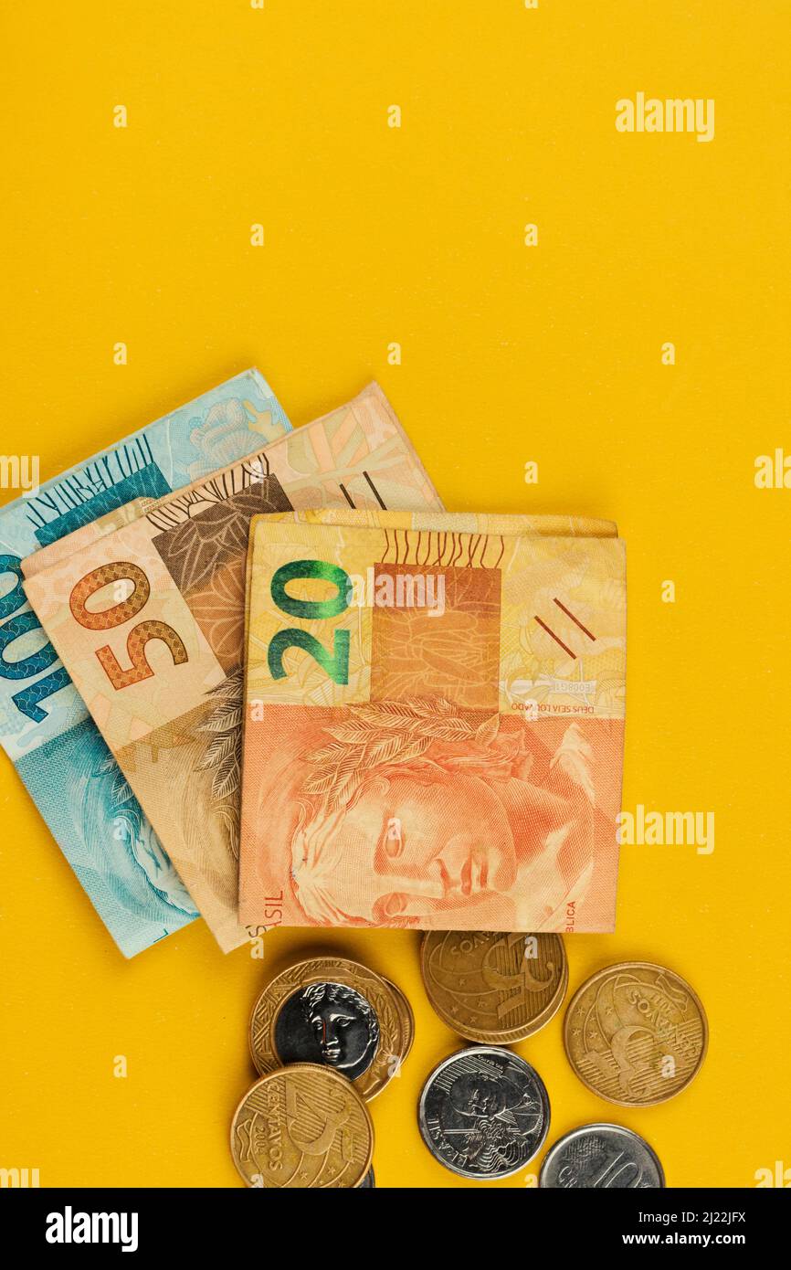 Brazilian money varied valures isolated on yellow background. Brazil ...