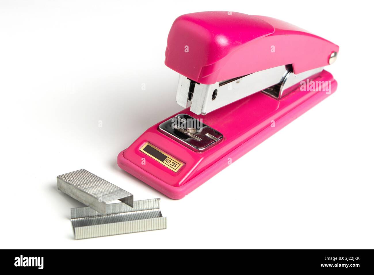 Stapler and metal staple concept over white background Stock Photo - Alamy