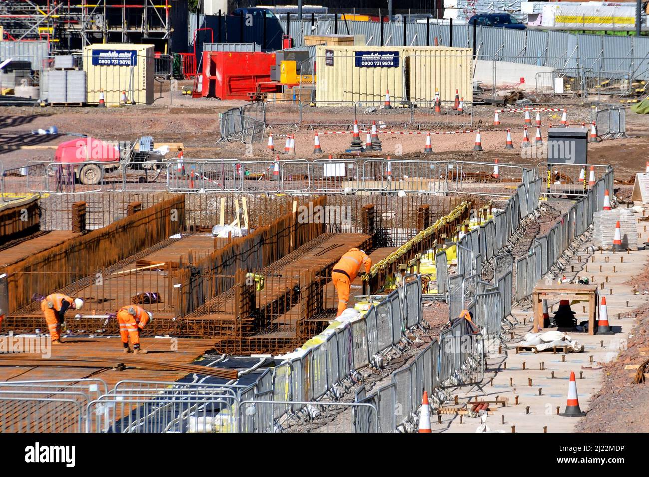Taffs Well, Wales - March 2022: Construction workers preparing steel ... Taffs Well, Wales - March 2022: Construction workers preparing steel ...