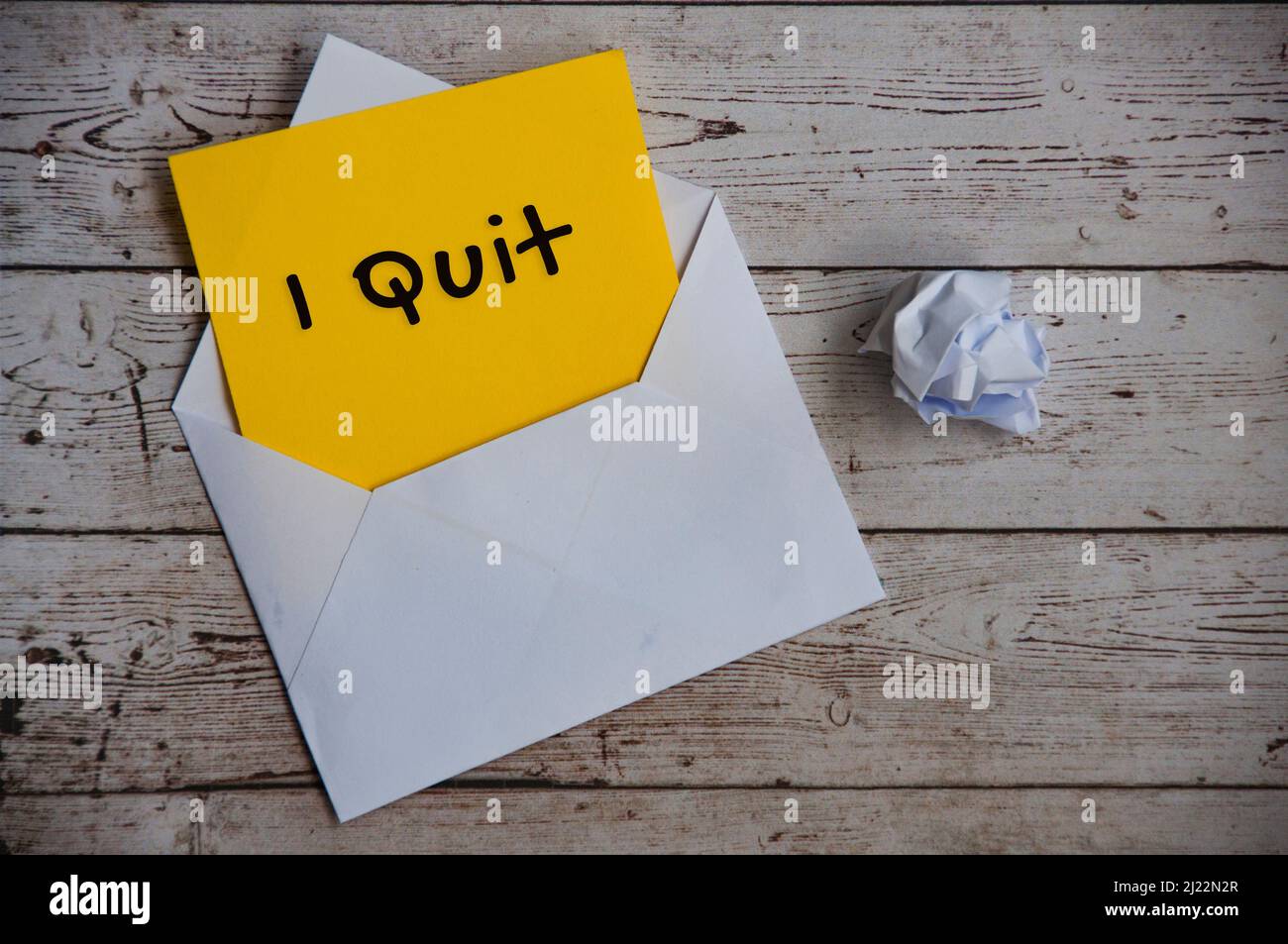 I quit text on yellow notepad in an envelope. Employment and ...