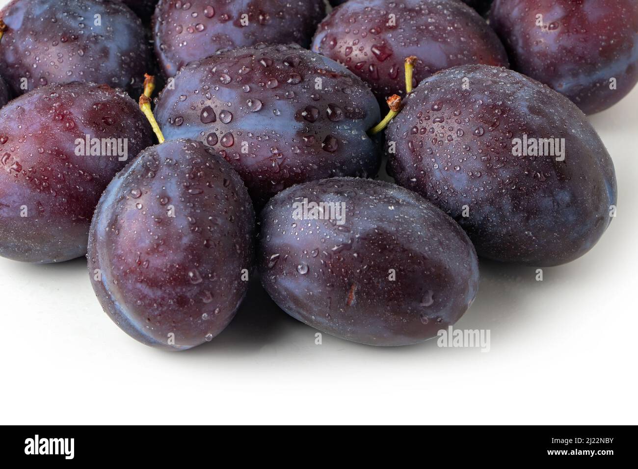 Plums with drops. background of beautiful home plums Stock Photo - Alamy