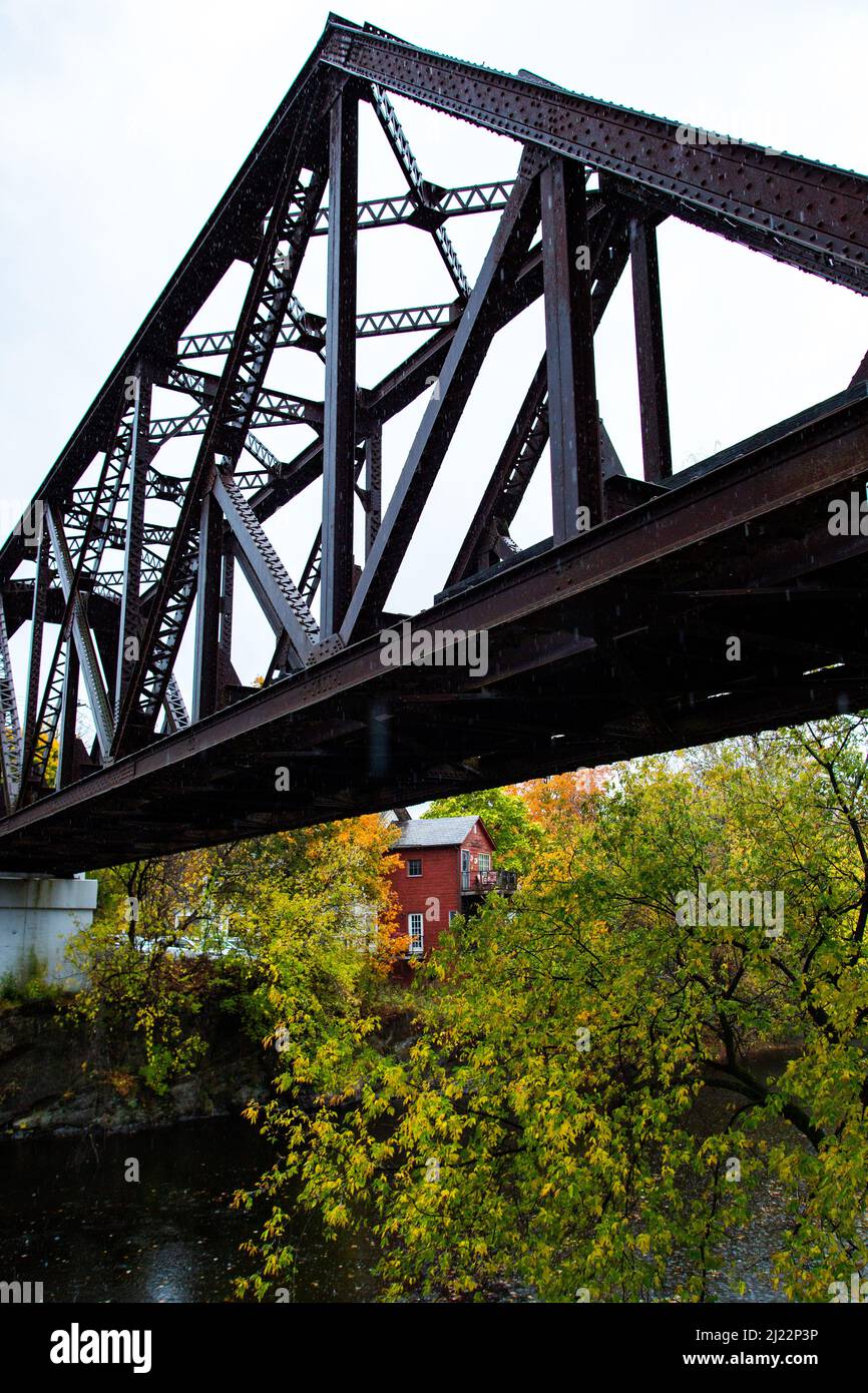 Steel bridge with small house on river Stock Photo - Alamy