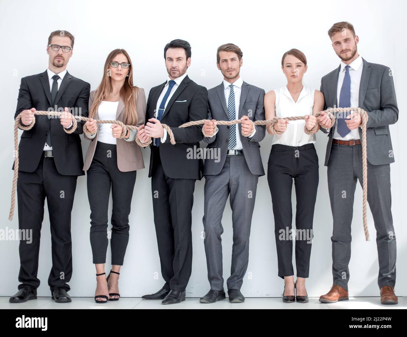group of young people tied with a strong rope Stock Photo - Alamy