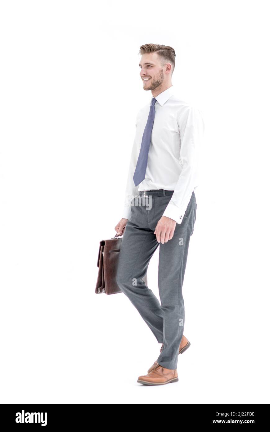 side view.smiling businessman confidently steps forward Stock Photo - Alamy