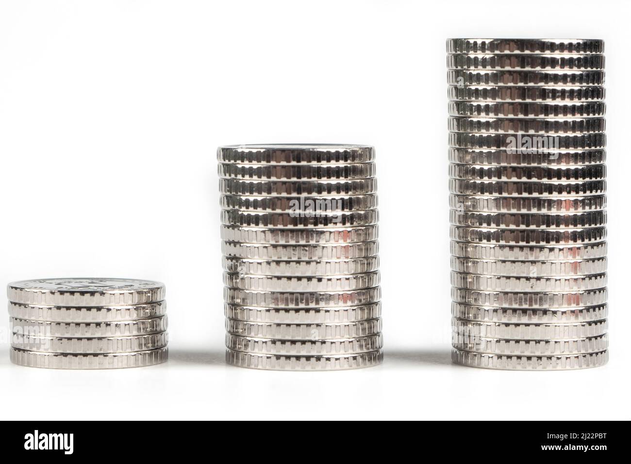 Stack of silver coins isolated on white background Stock Photo - Alamy