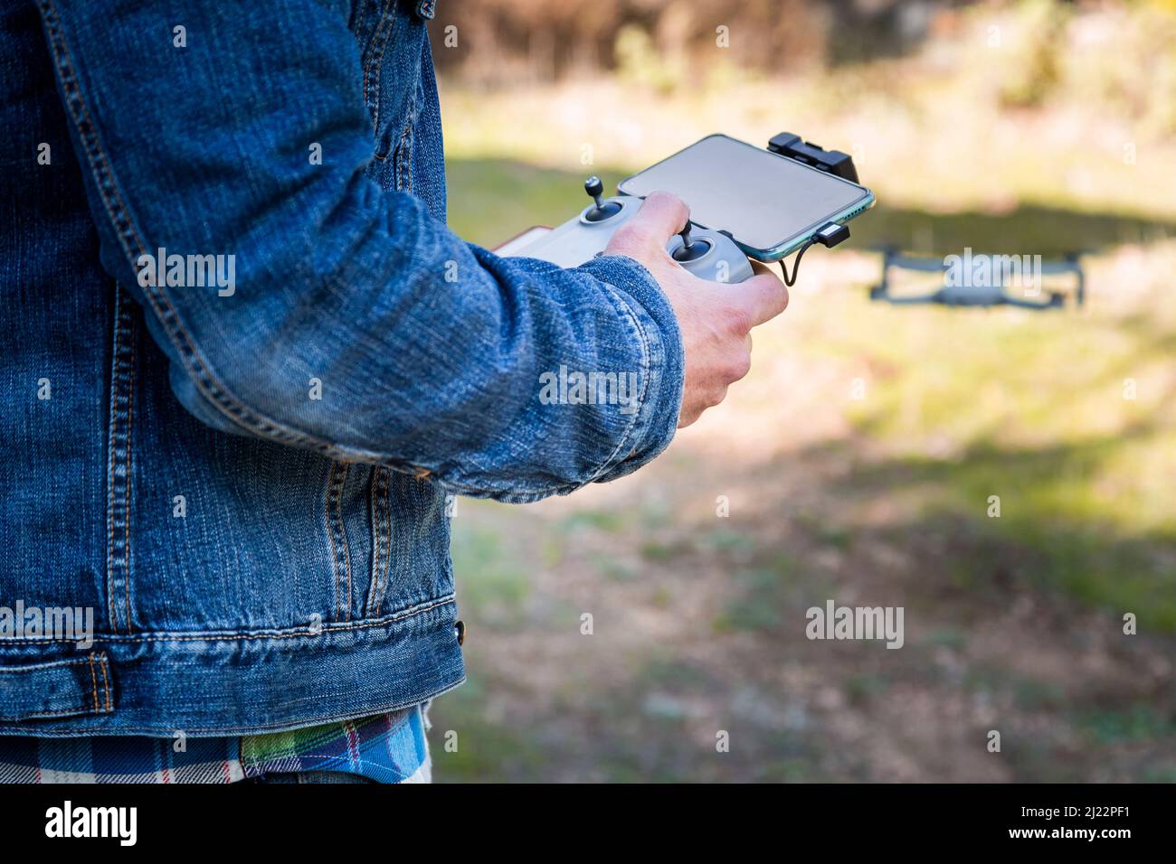 Man operating a remote controlled drone Stock Photo - Alamy