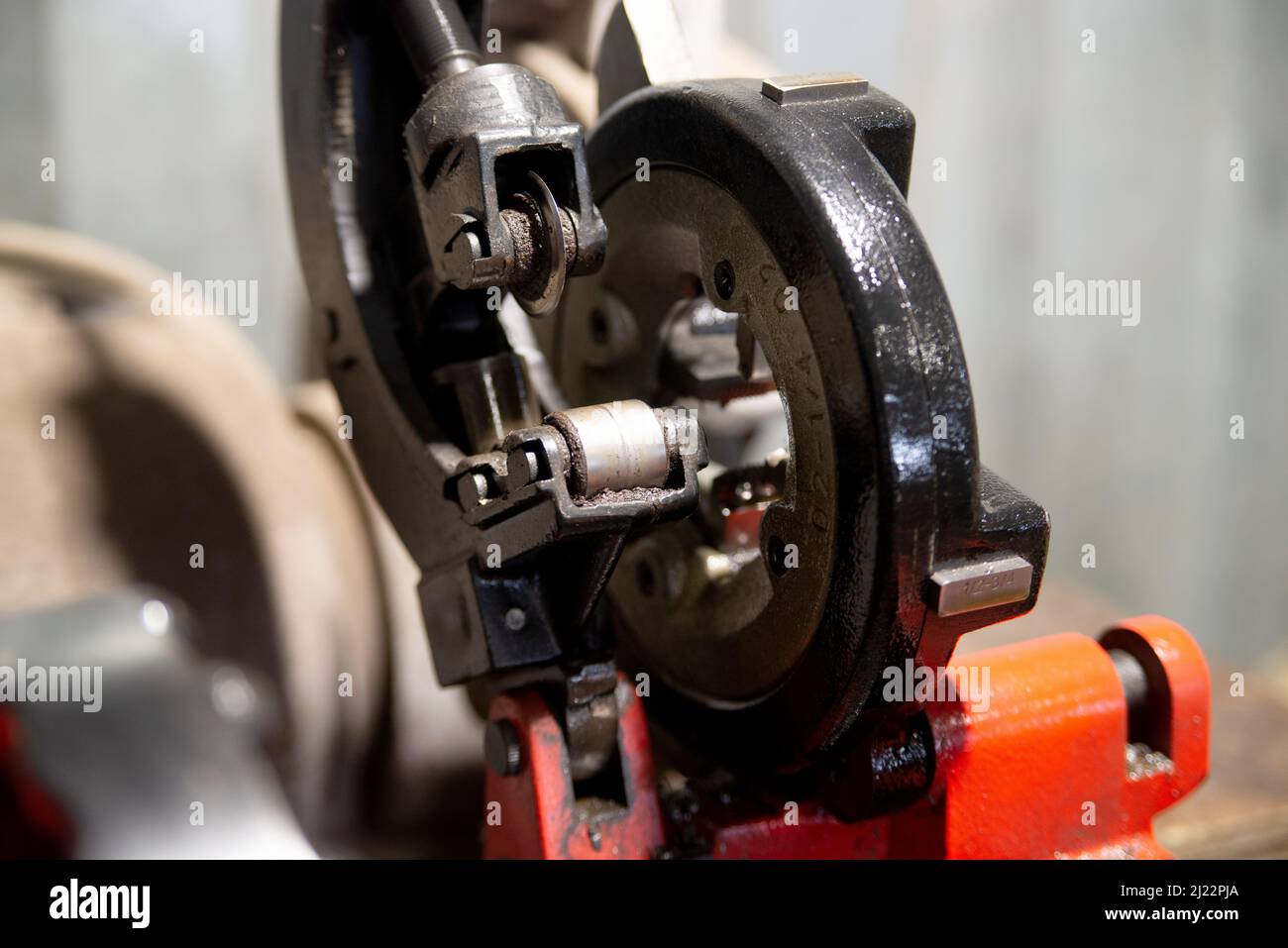 Close up view of pipe cutter. Hi-technology parts manufacturing process ...