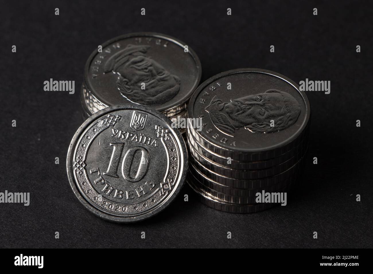 Silver coins on dark background. Ukrainian 10 hryvnias coins. Money and ...