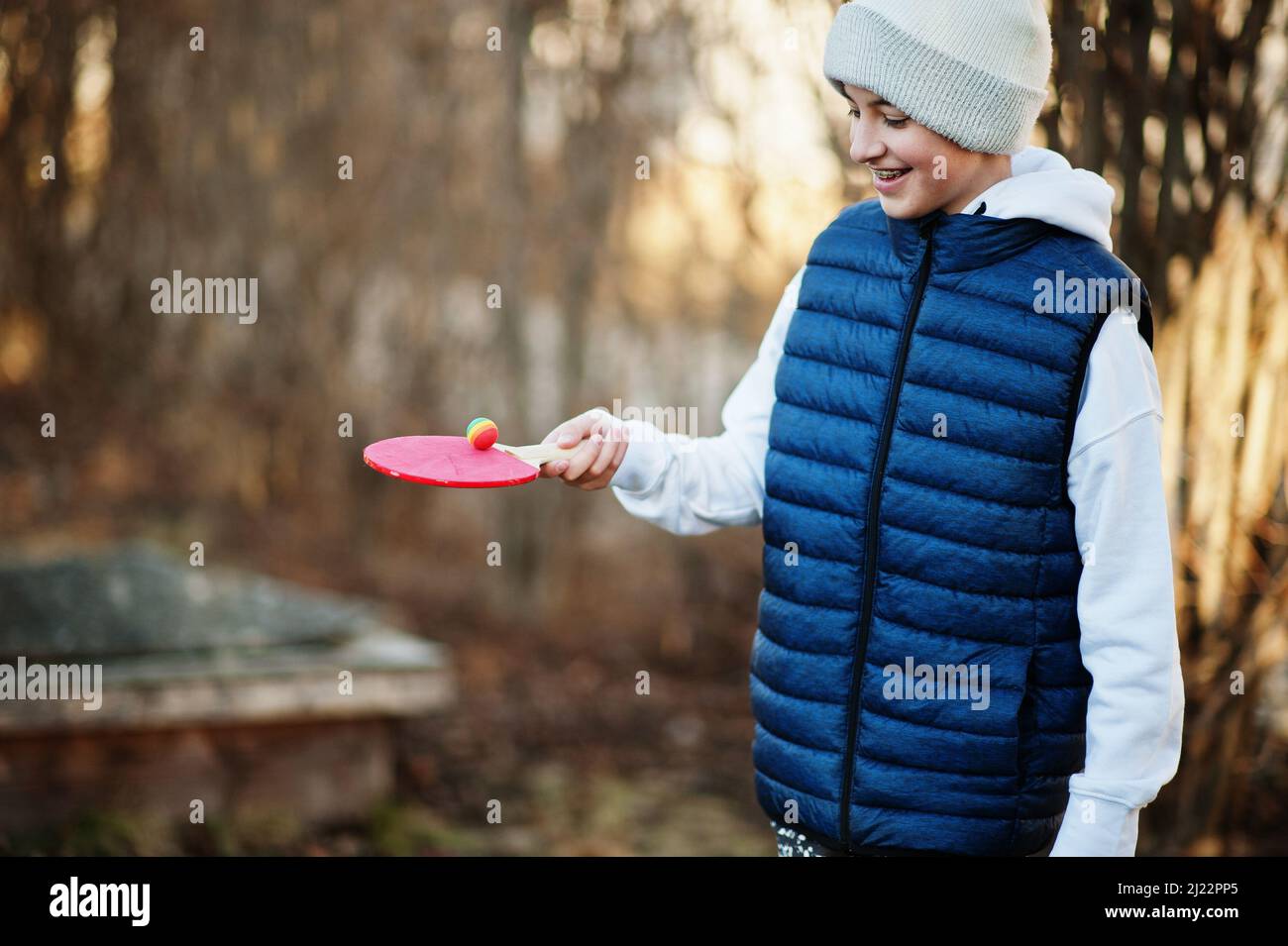 Boy play hold ball on the racket Stock Photo - Alamy