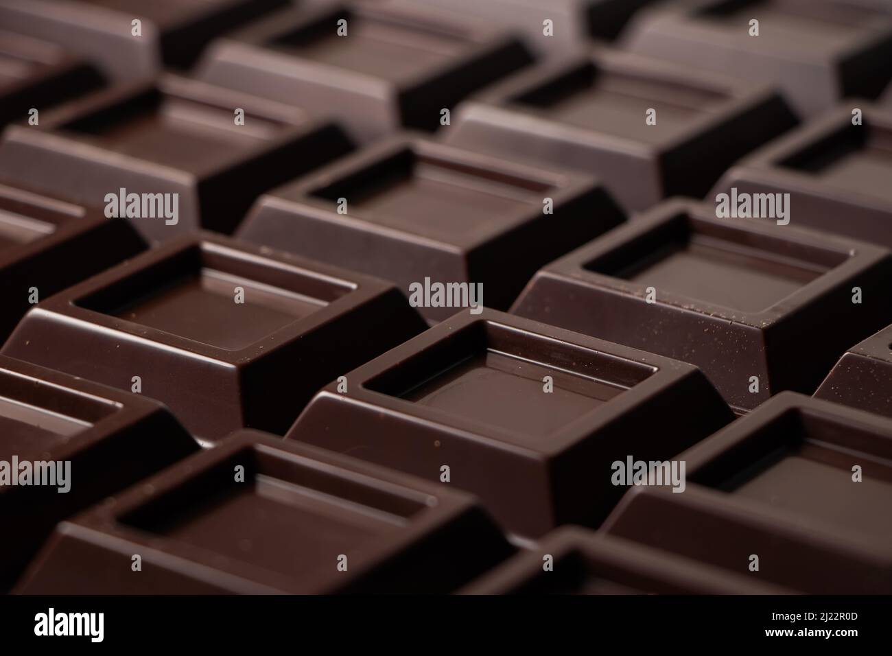 Close up a chocolate bar background. Chocolate bar cubes macro Stock ...