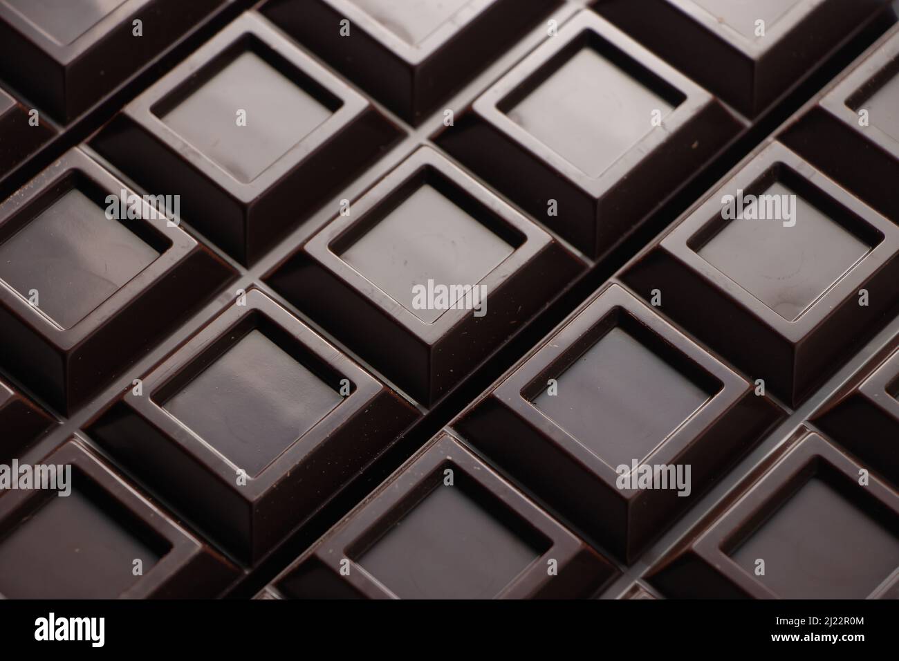 Close up a chocolate bar background. Chocolate bar cubes macro Stock ...