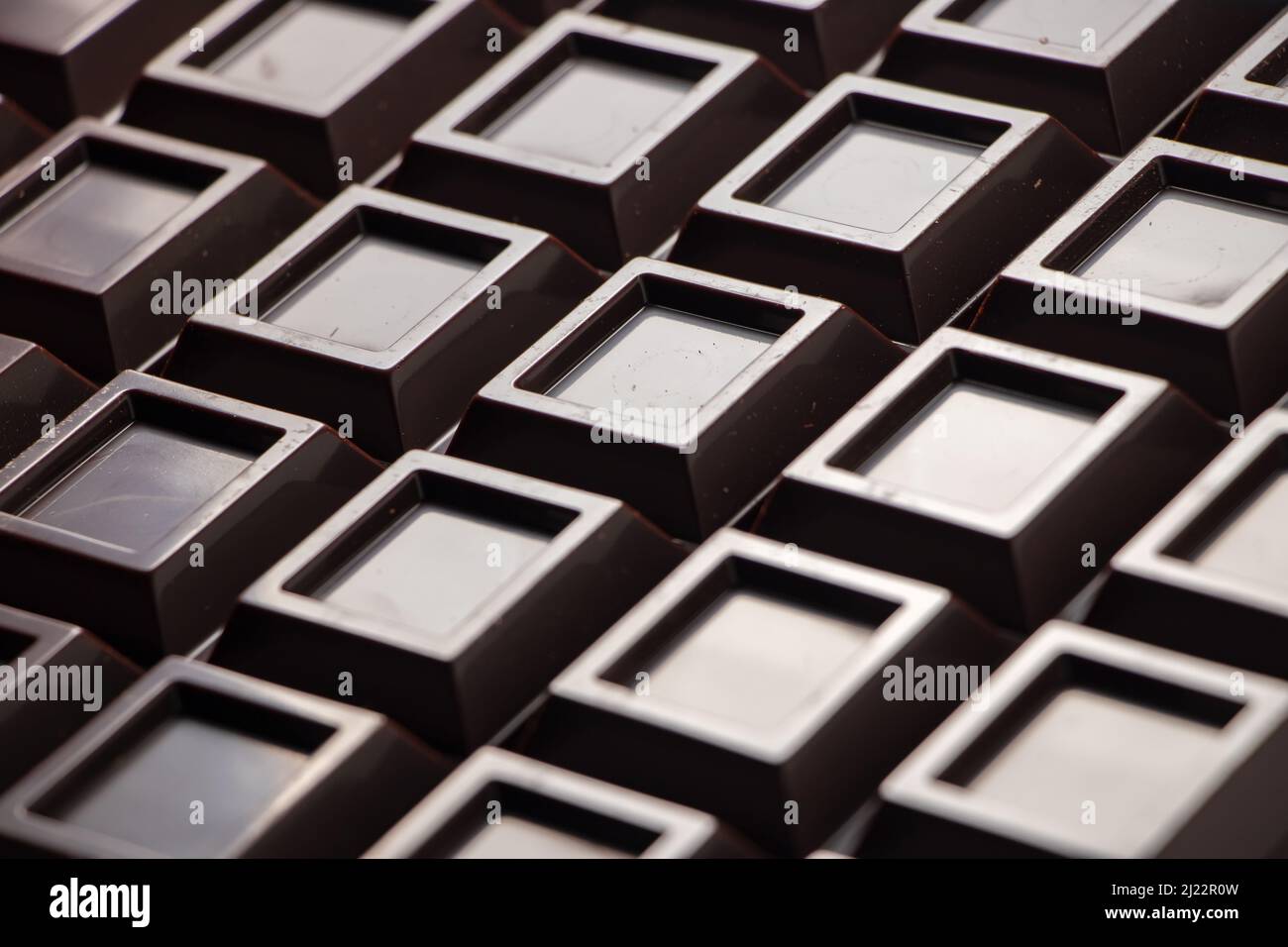 Close up a chocolate bar background. Chocolate bar cubes macro Stock ...