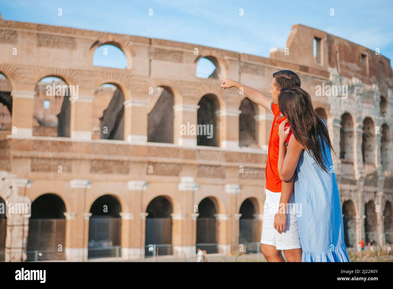 Happy family in Europe. Romantic couple in Rome over Coliseum ...